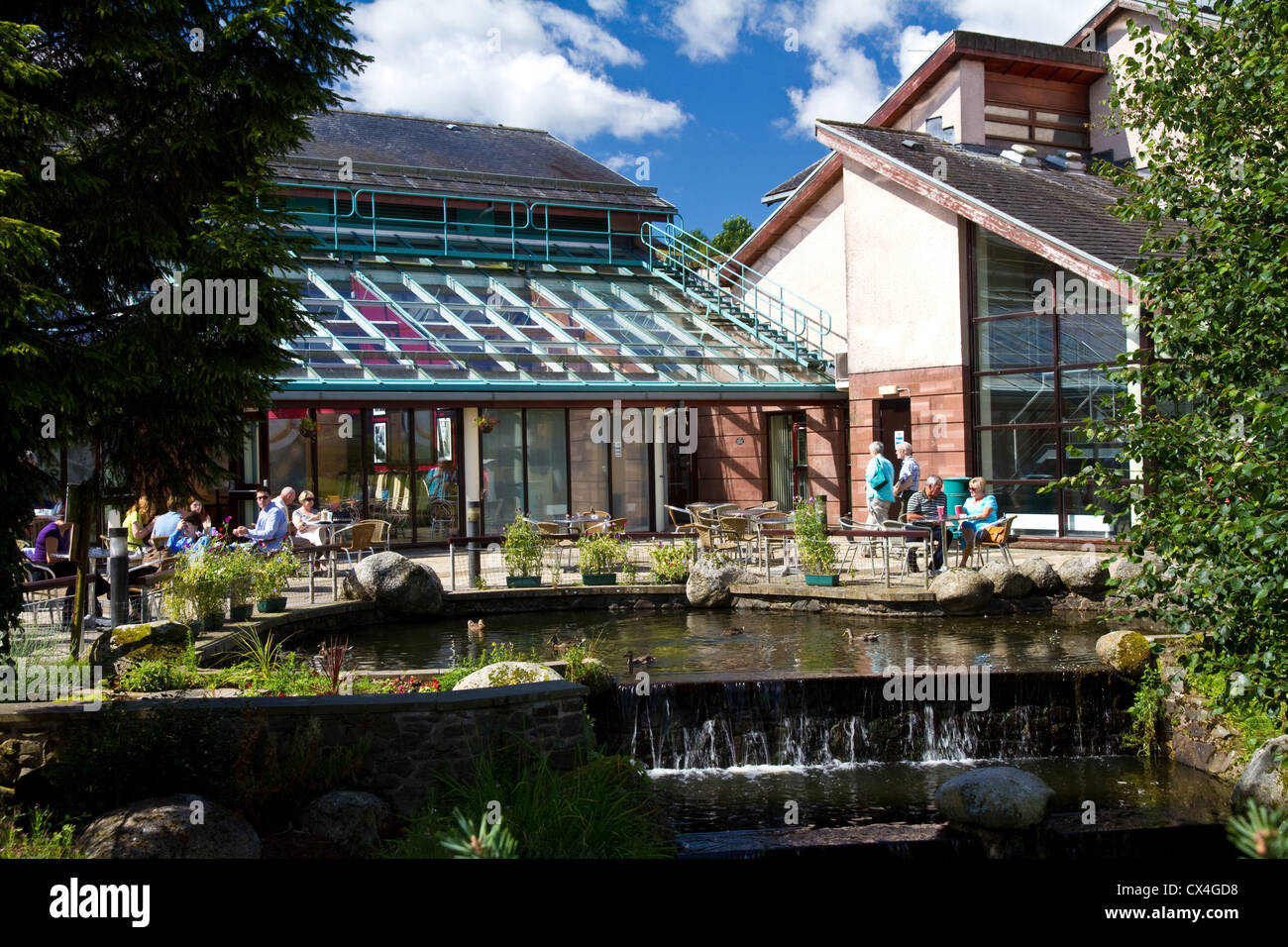 Outdoors in the sunshine at the motorway service station on the A74M at ...