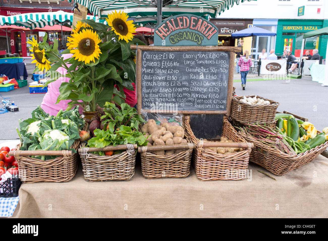 Market stall with organic vegetables displayed in baskets Stock Photo ...