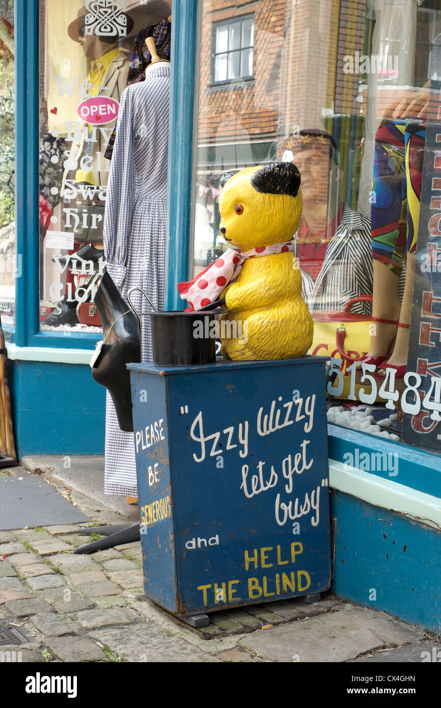 Old fashioned Sooty the Bear charity money box outside of a shop ...