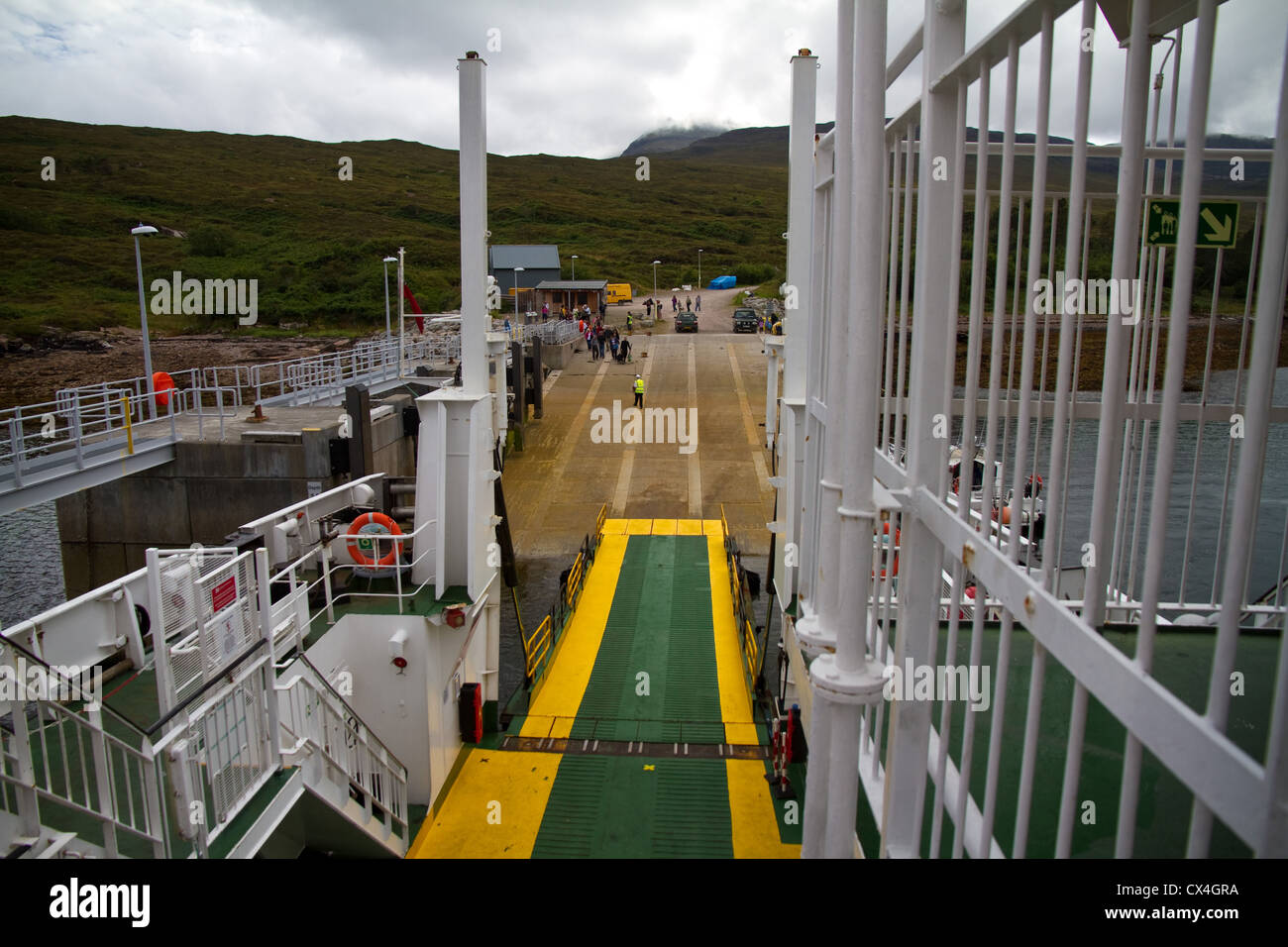 Passengers boarding the CalMac ferry at Rum, the Small Isles, Scotland ...