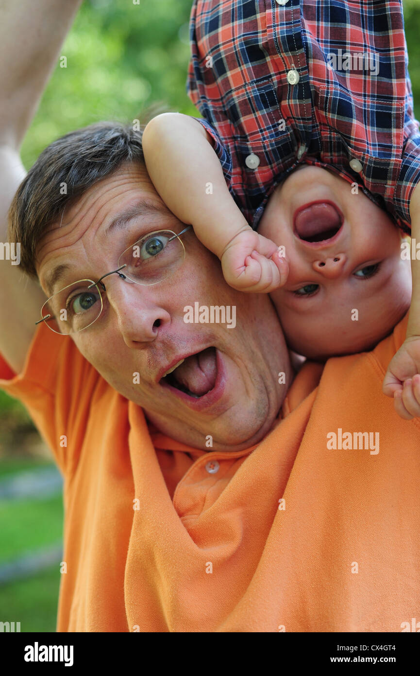 white Caucasian father and son being silly and goofy playful and happy ...