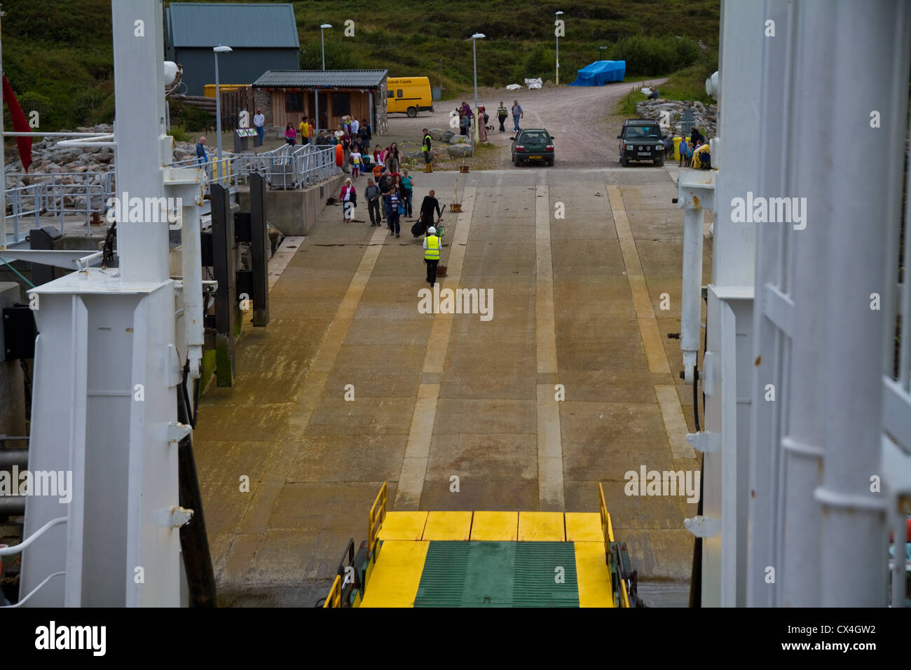 Passengers boarding the CalMac ferry at Rum, the Small Isles, Scotland ...