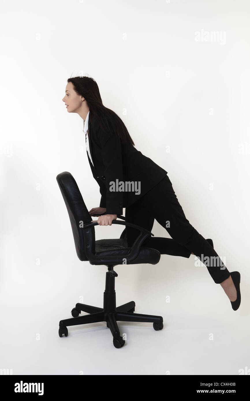 Person pushing office chair hi-res stock photography and images - Alamy