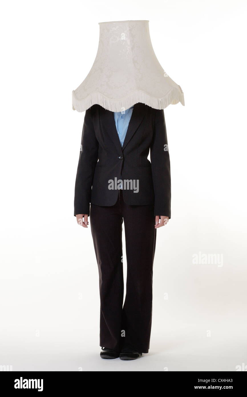 business woman with a lamp shade on her head standing Stock Photo - Alamy