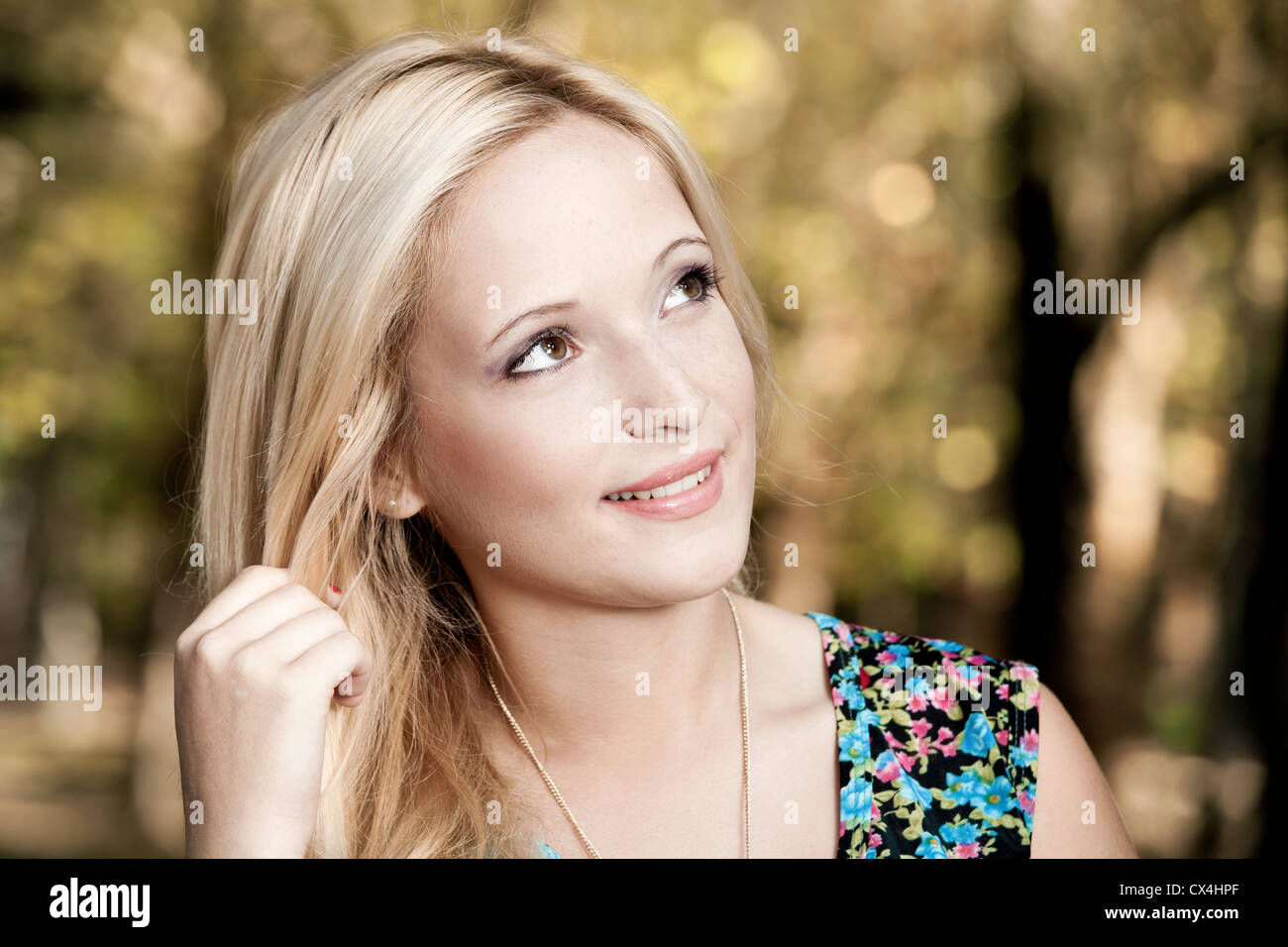 Outdoor portrait of a beautiful young girl smiling Stock Photo - Alamy