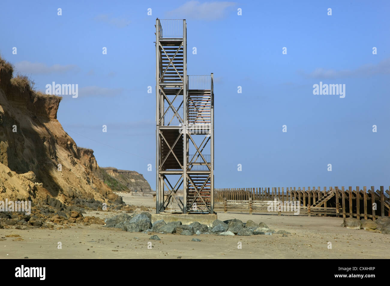 Cliff stairway now isolated Coastal erosion Happisburgh Norfolk UK ...