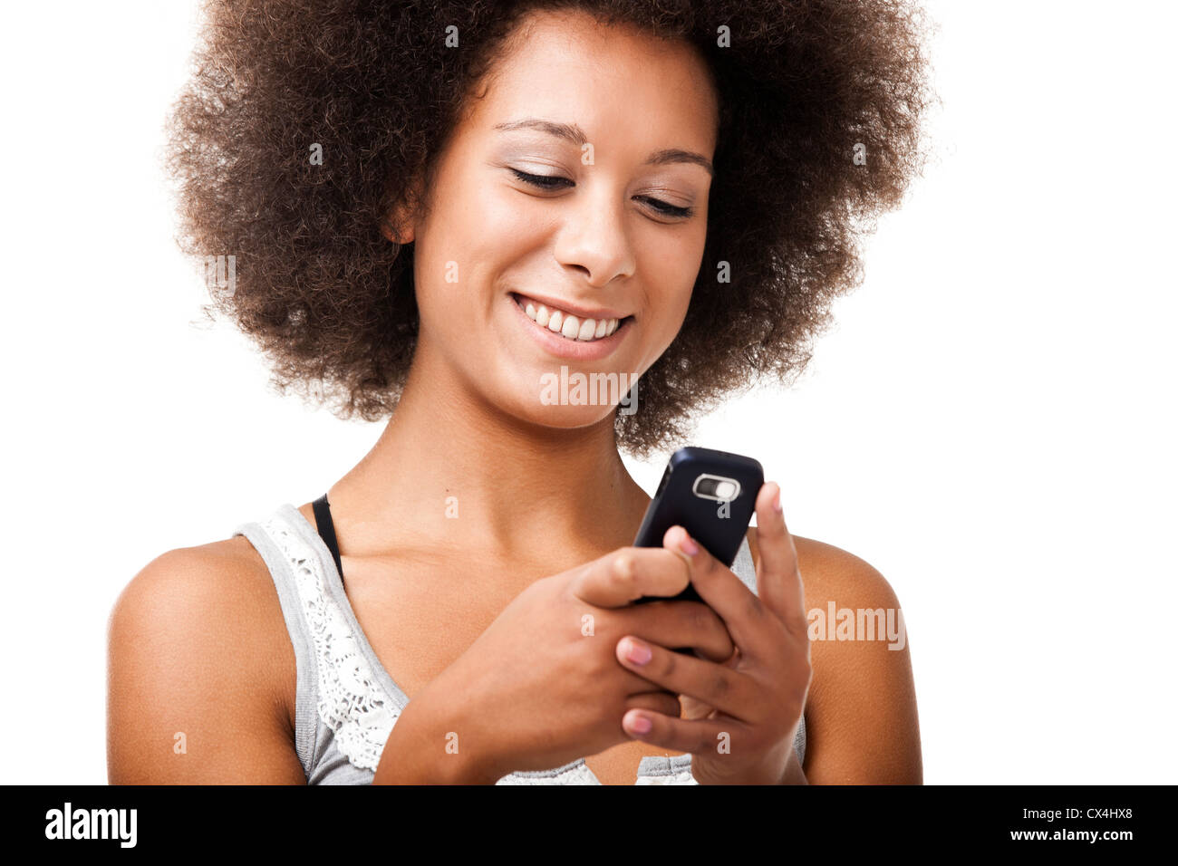 Beautiful African American woman sending a sms on cell phone, isolated ...