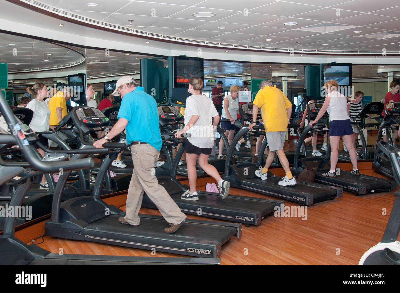 Passengers making exercises in the fitness room, Cruise ship Stock ...