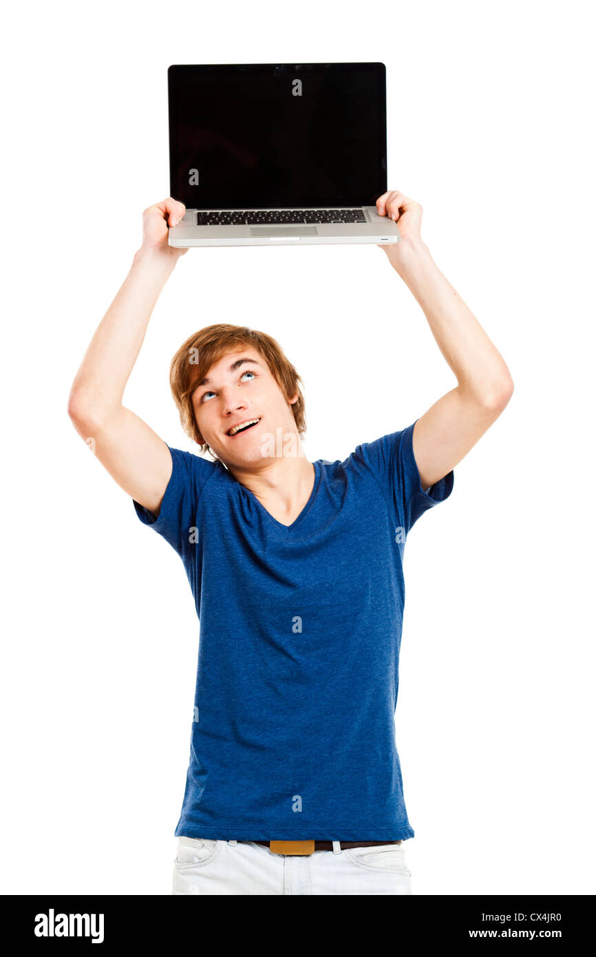 Handsome young man holding a laptop isolated over a white background ...
