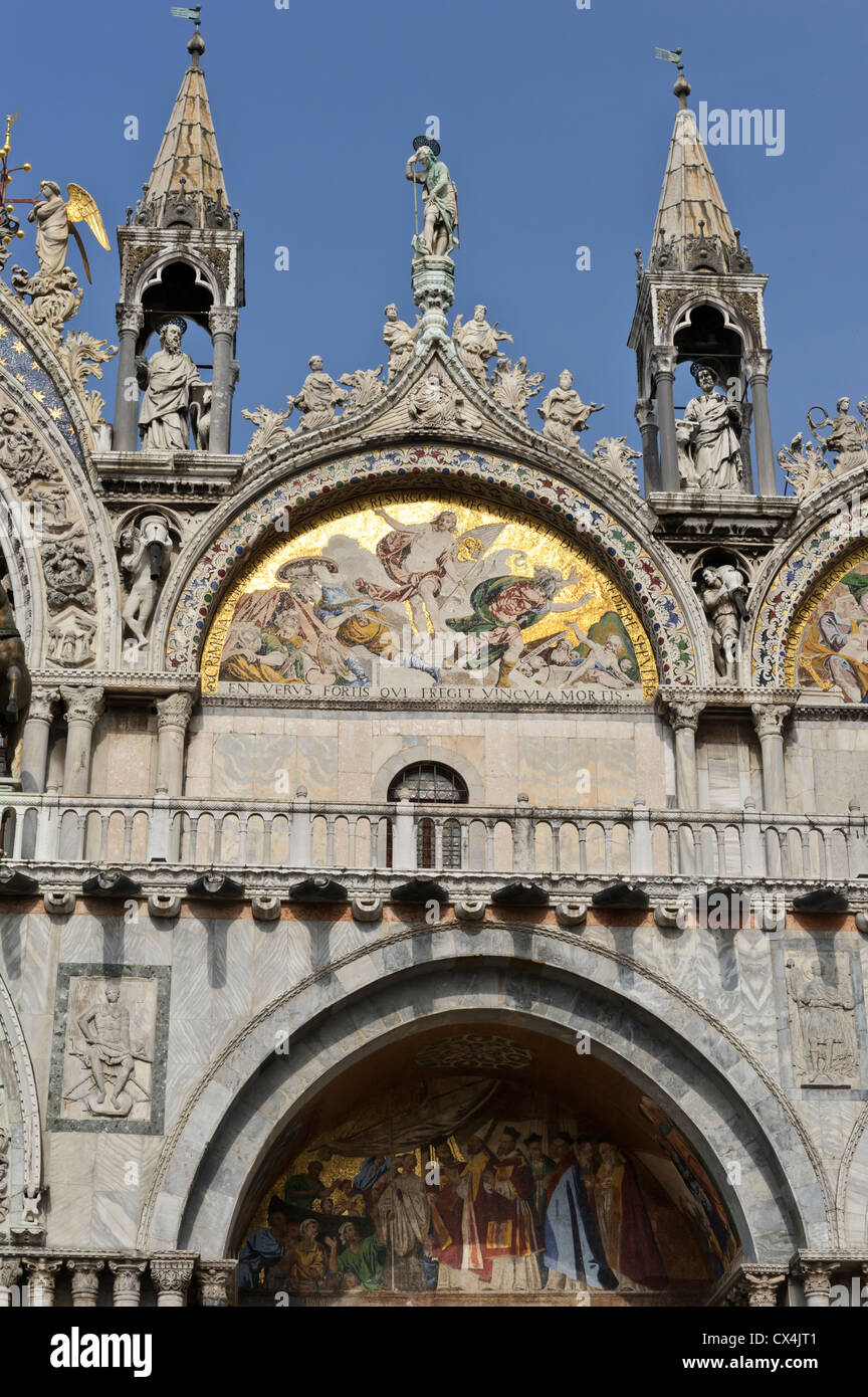 Religious paintings and statues on the arches of St Mark's Basilica, St ...