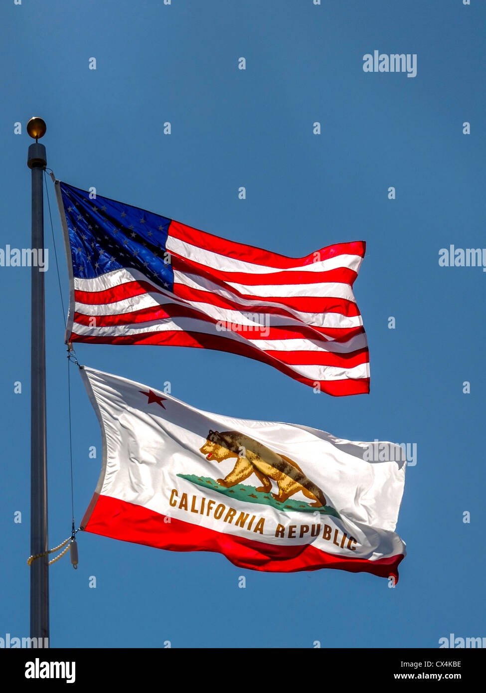 The State of California "Bear Flag" flies along with the U.S. flag on a ...