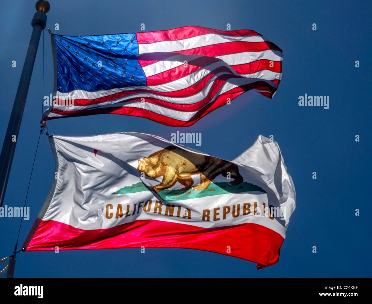The State of California "Bear Flag" flies along with the U.S. flag on a ...