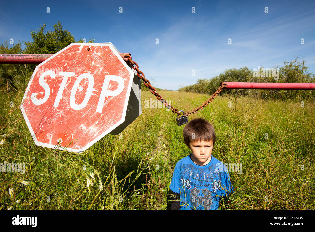 A young First nation boy and sled dog in Fort Chipweyan Stock Photo - Alamy