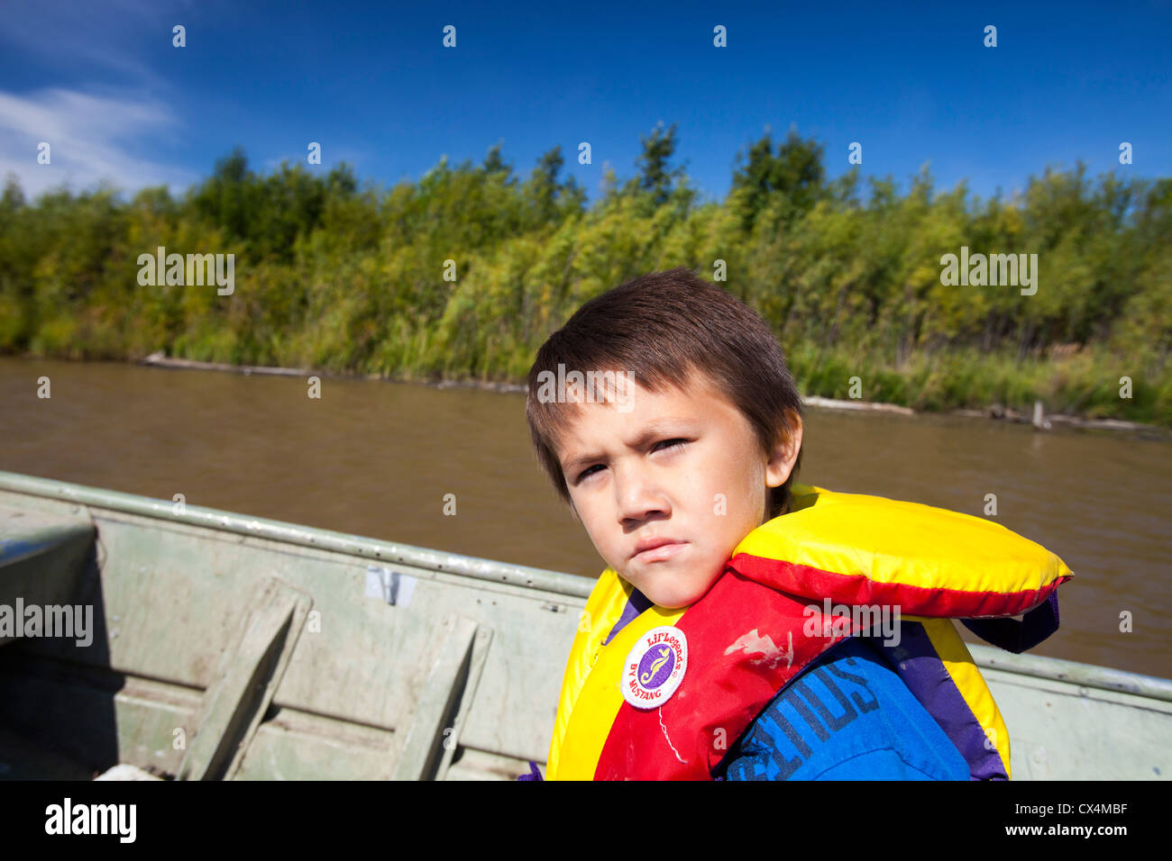 A young First nation boy and sled dog in Fort Chipweyan Stock Photo - Alamy
