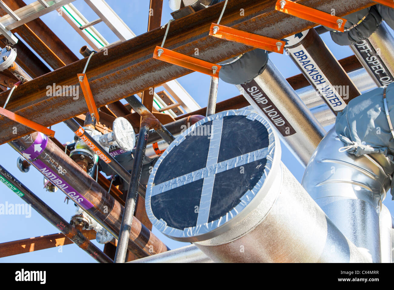 Trucks haul an oversize load of tar sands equipment for a SAG D mine ...