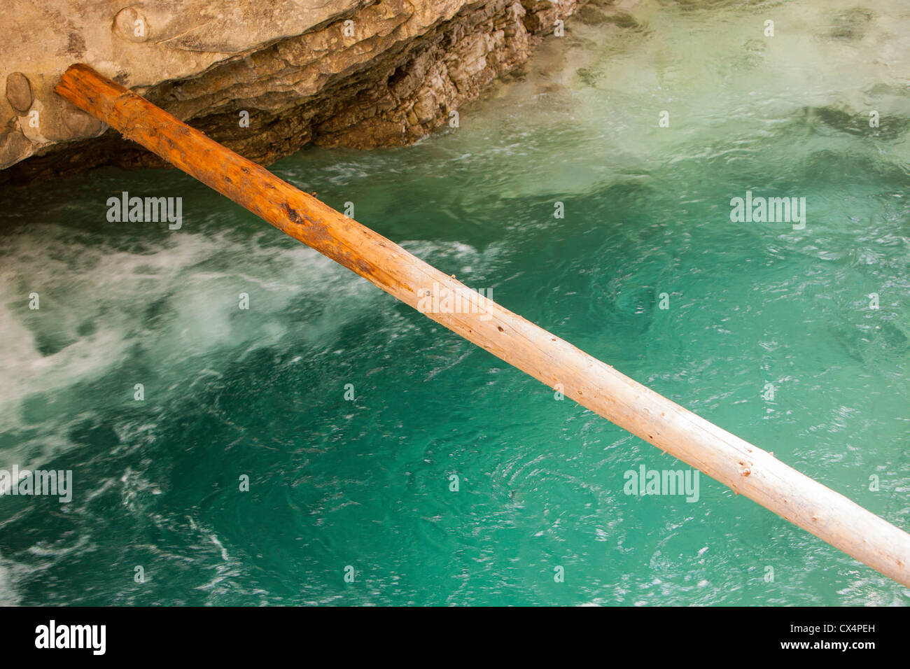 A log wedged across the river in Johnsons Canyon in the Banff national ...