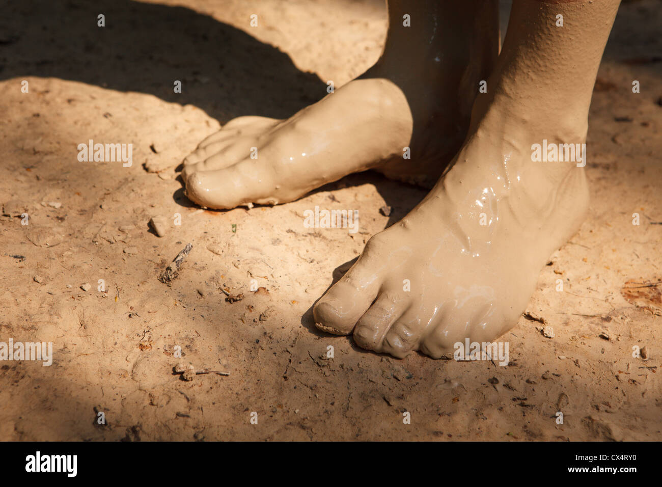 Feet in mud close-up Stock Photo - Alamy