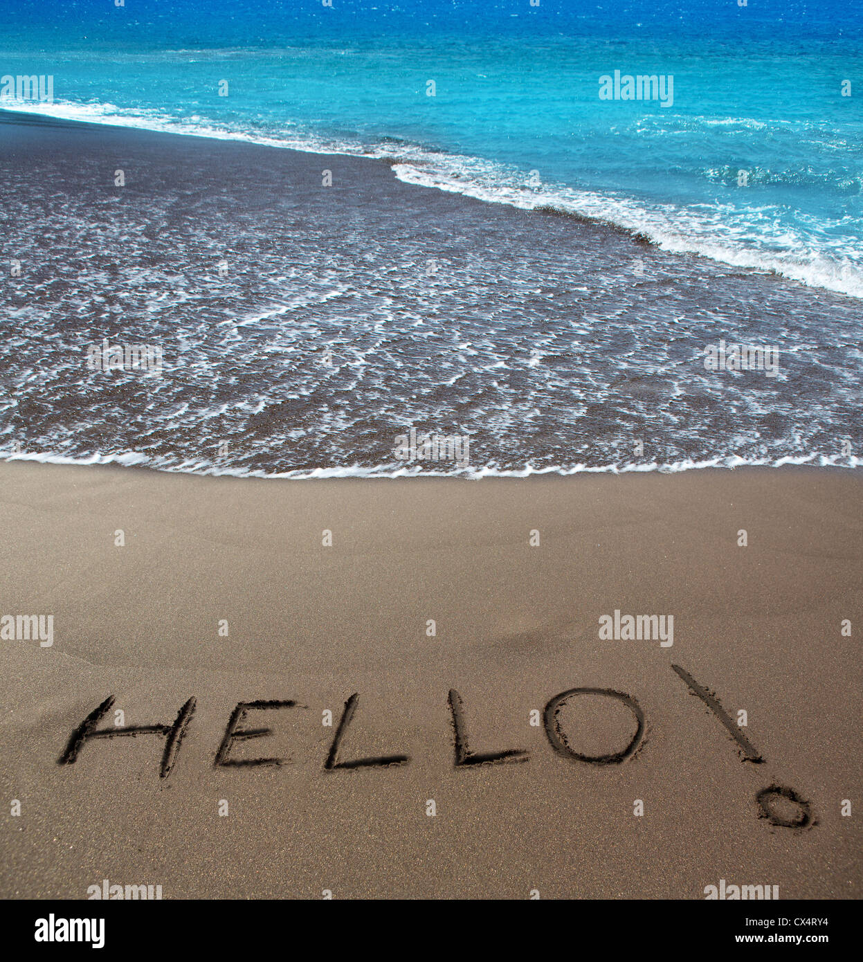 Brown sand beach with written word Hello in Canary Islands Stock Photo ...