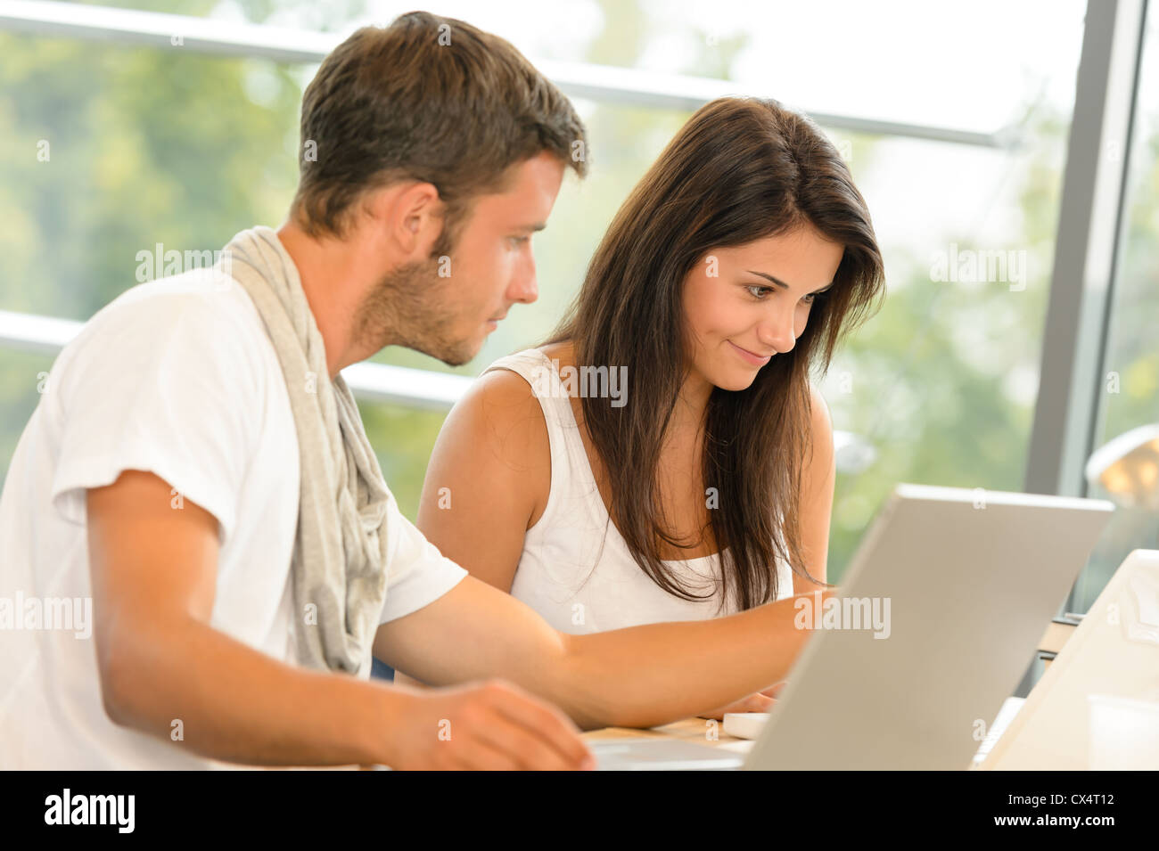 Happy pupils using laptop class hi-res stock photography and images - Alamy