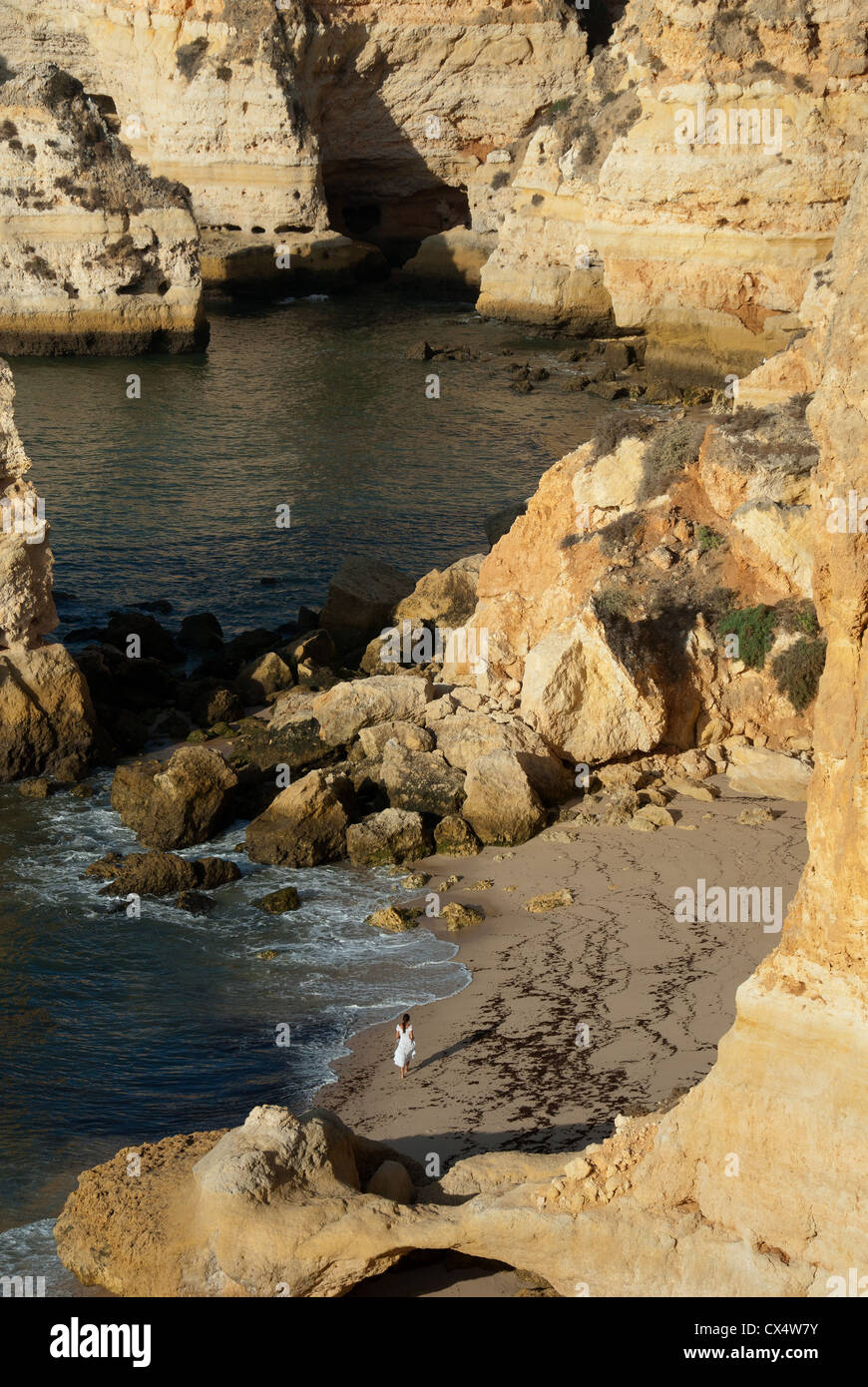Girl walking over rocks hi-res stock photography and images - Alamy