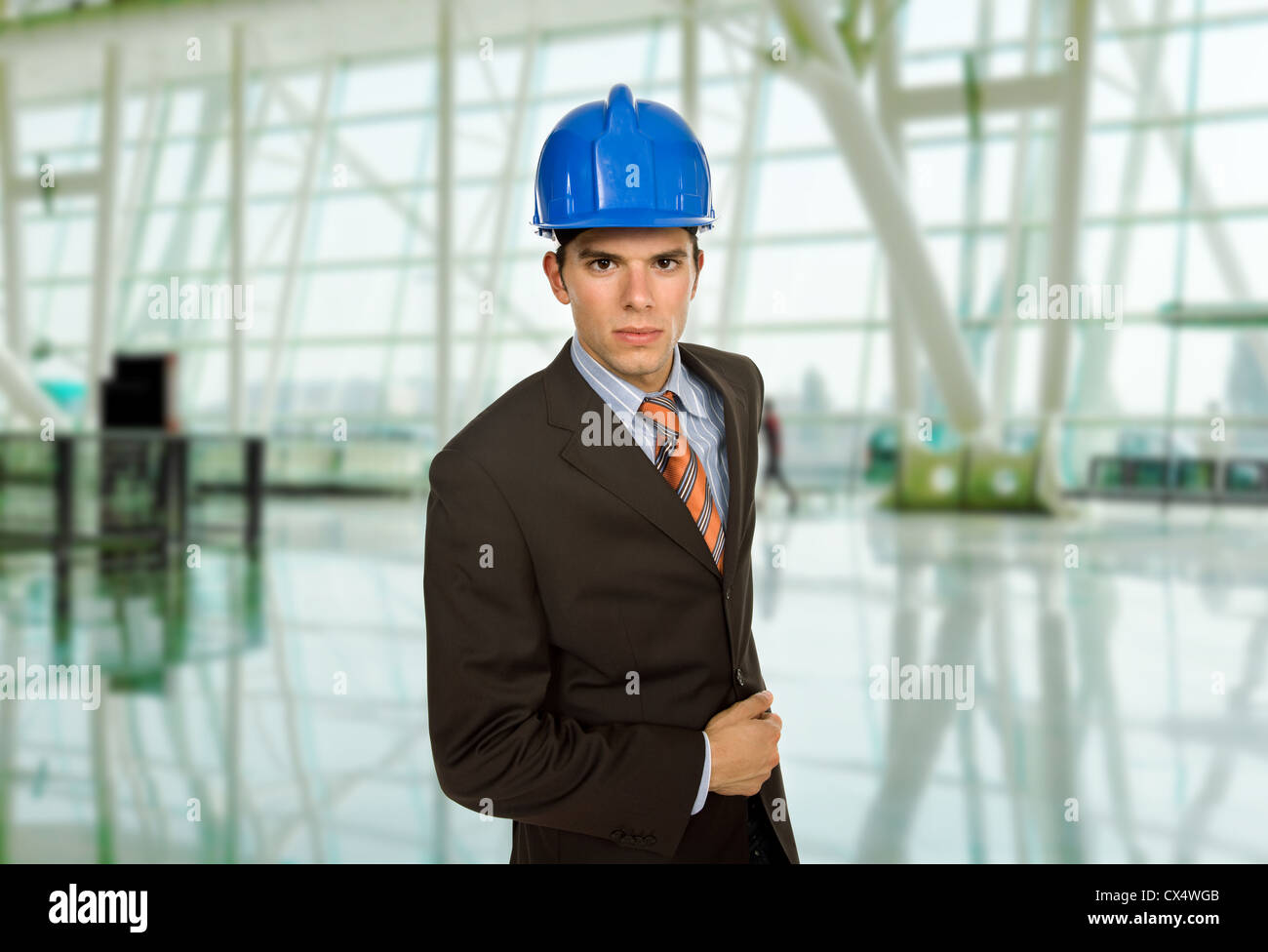 An engineer with blue hardhat at the office Stock Photo - Alamy