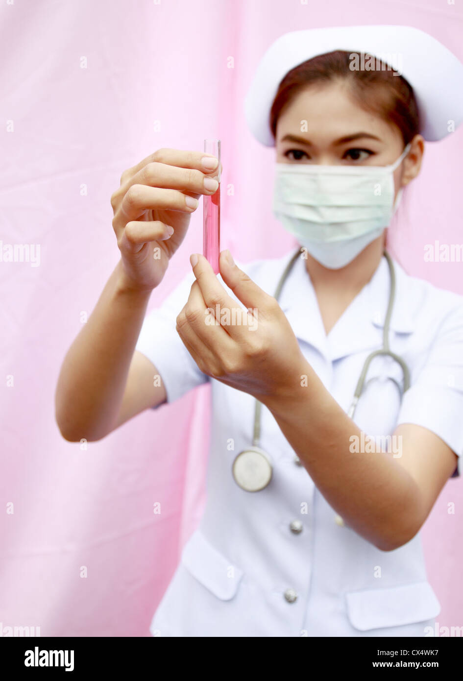 Female nurse with test tube Stock Photo - Alamy