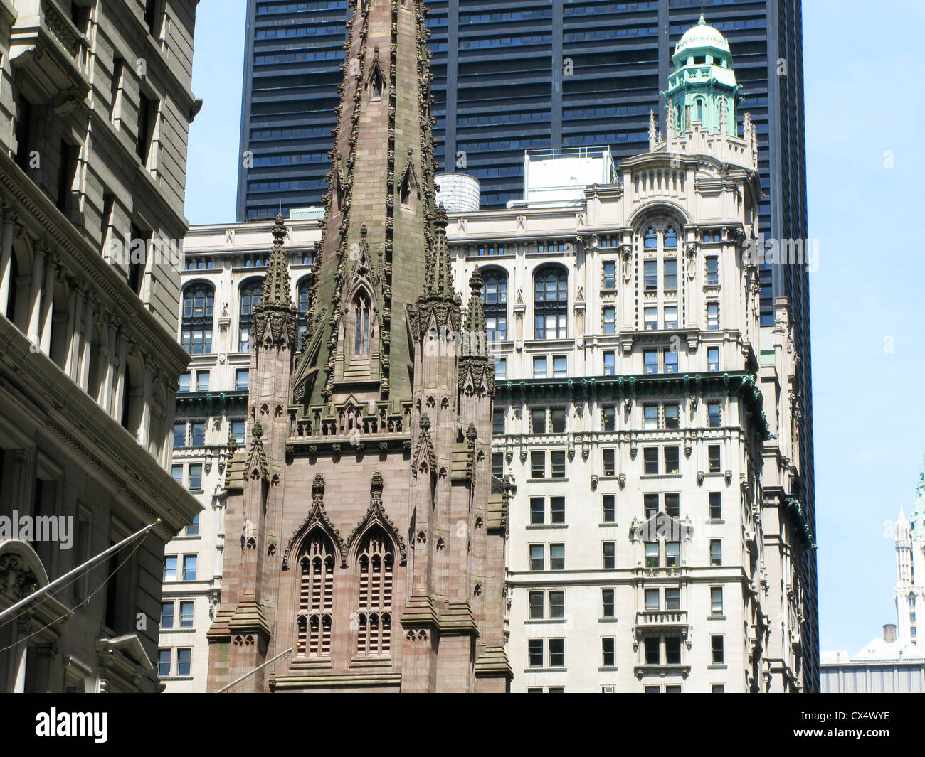 View up from street level to trinity church, various building styles ...