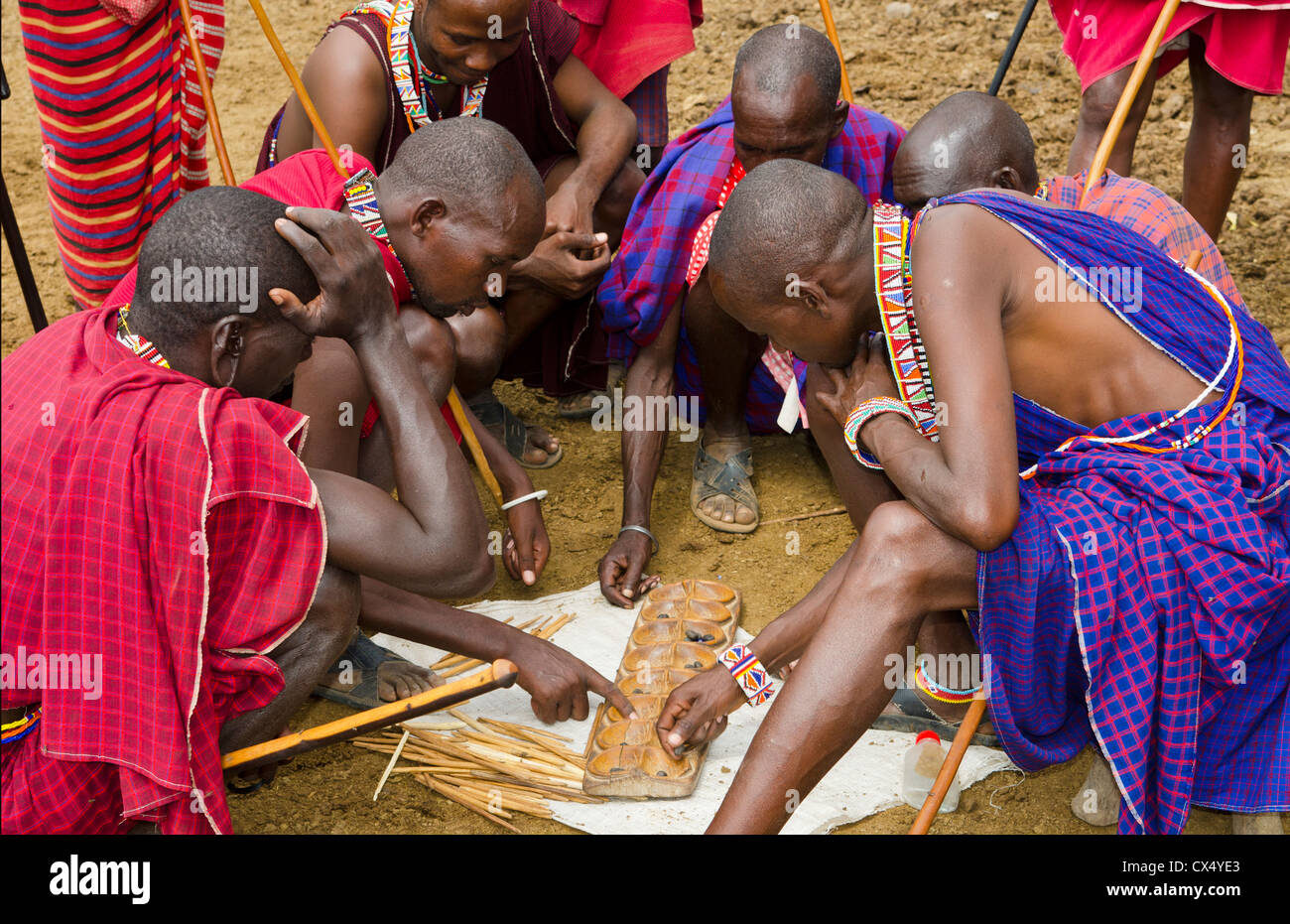 Amboseli National Park Kenya Africa safari Masai men playing Bao game ...