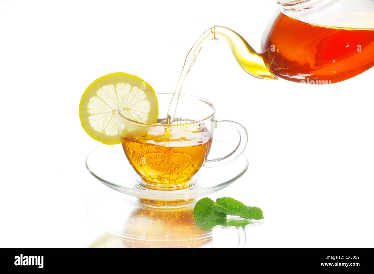tea being poured into glass tea cup Stock Photo - Alamy