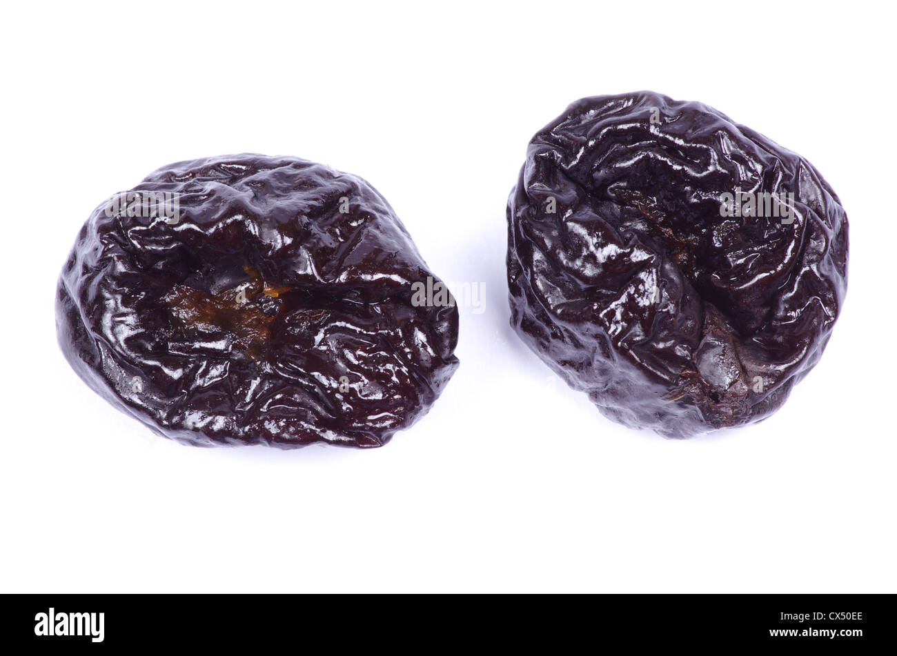 dried plum on a white background Stock Photo - Alamy