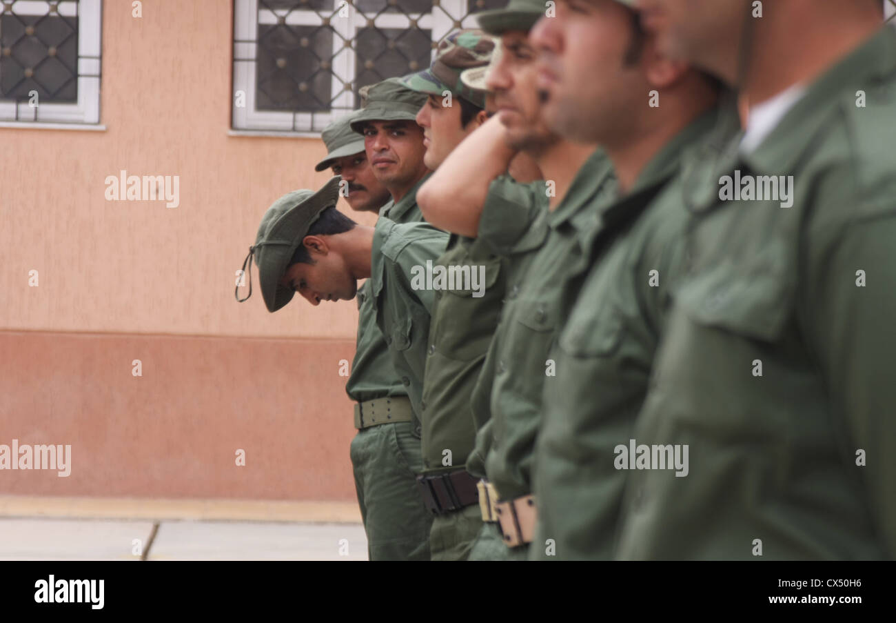 Members of Misrata's police force attend a graduation ceremony as heavy ...