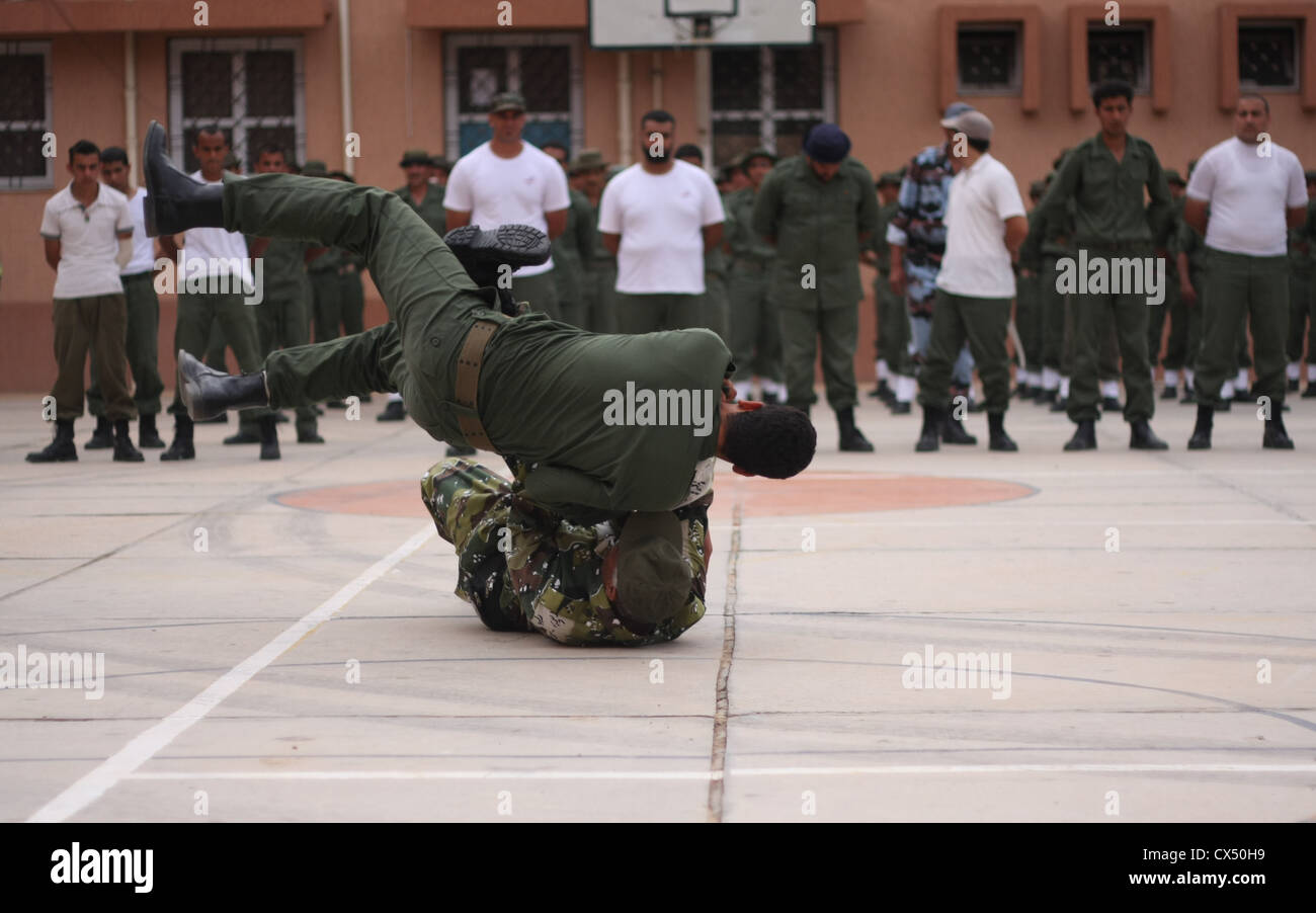Members of Misrata's police force attend a graduation ceremony as heavy ...