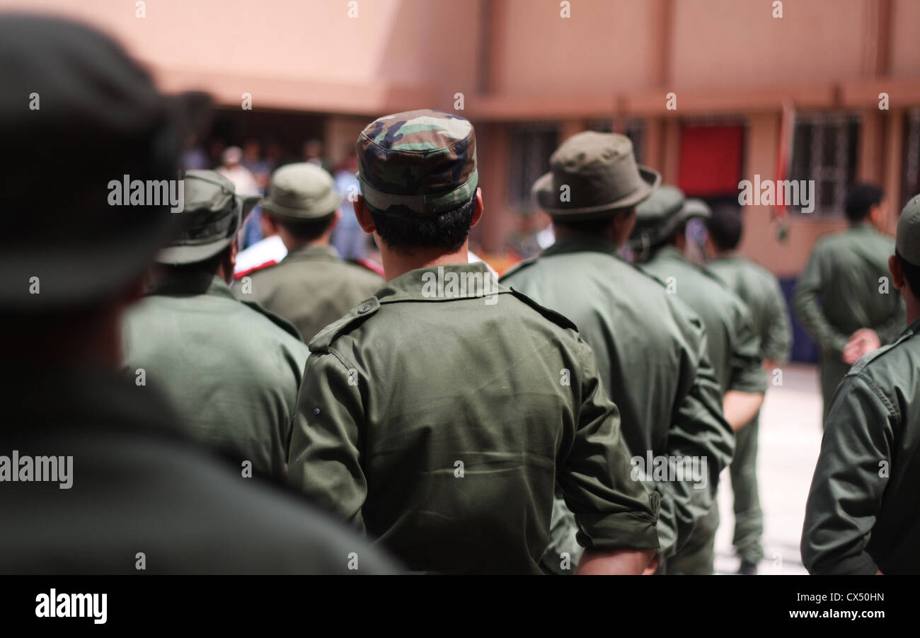 Members of Misrata's police force attend a graduation ceremony as heavy ...