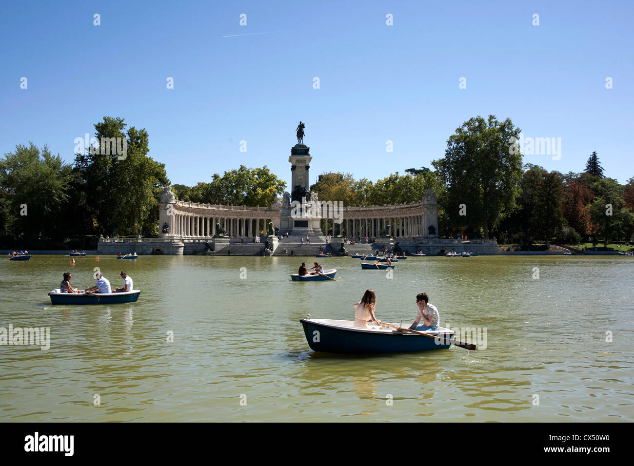 People boating on the lake in Retiro Park. The lake was originally part ...