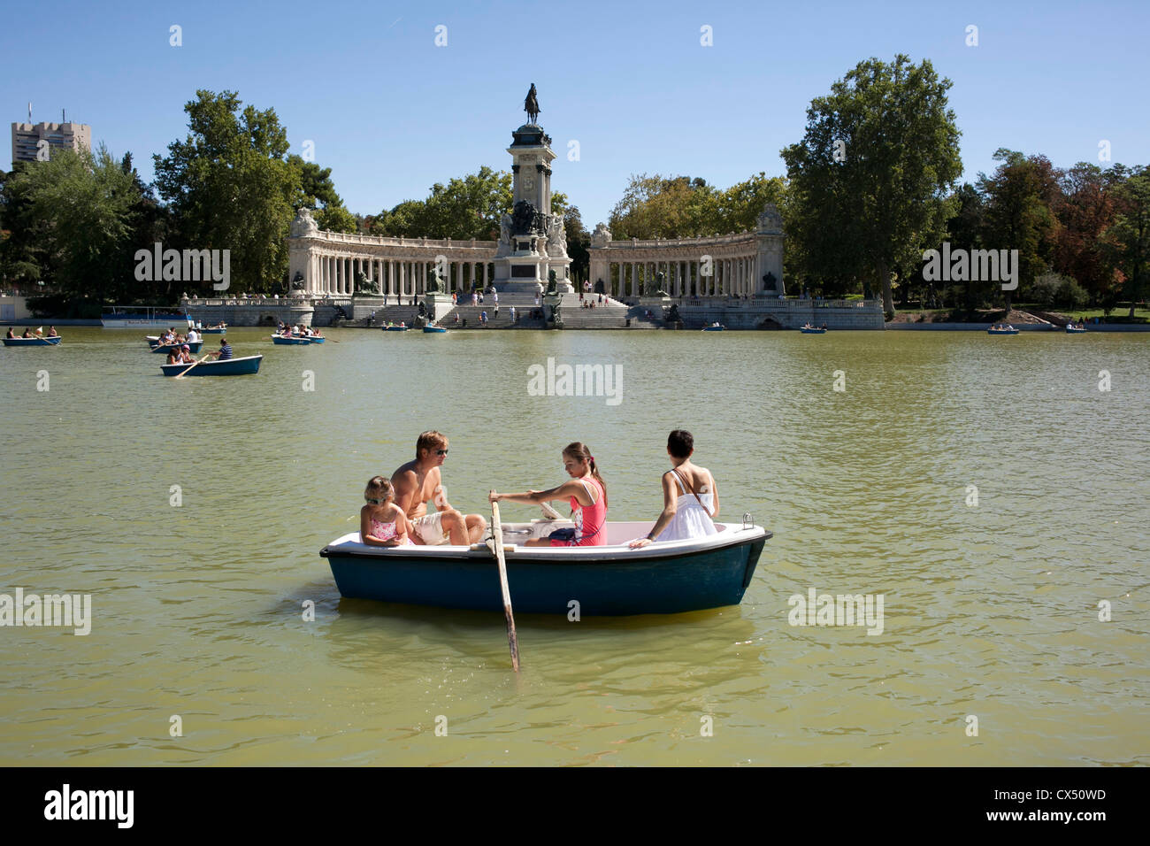 People boating on the lake in Retiro Park. The lake was originally part ...