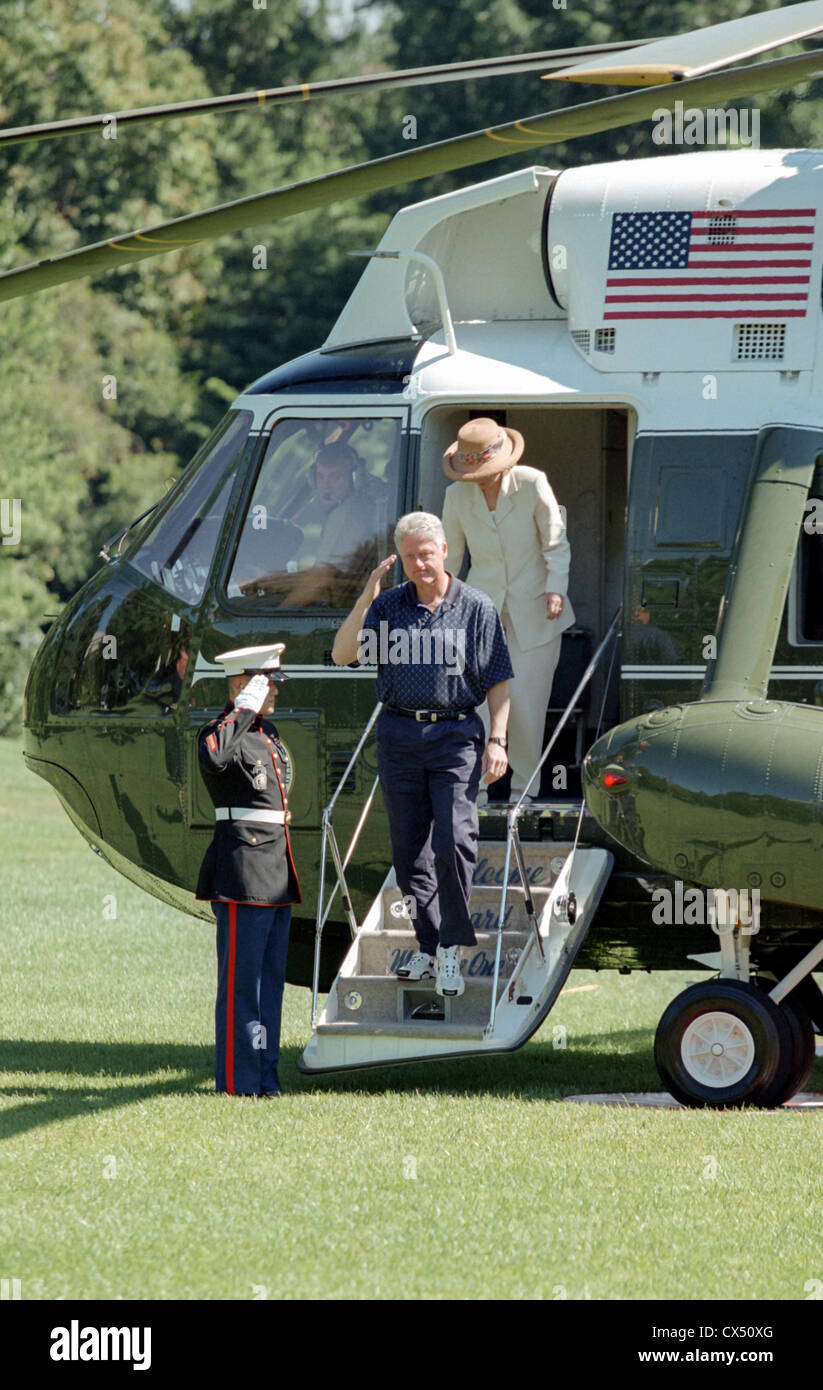 President Bill Clinton and first lady Hillary Clinton return from a ...