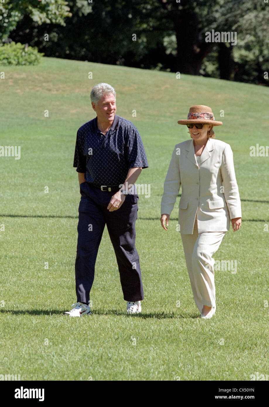 President Bill Clinton and first lady Hillary Clinton return from a ...