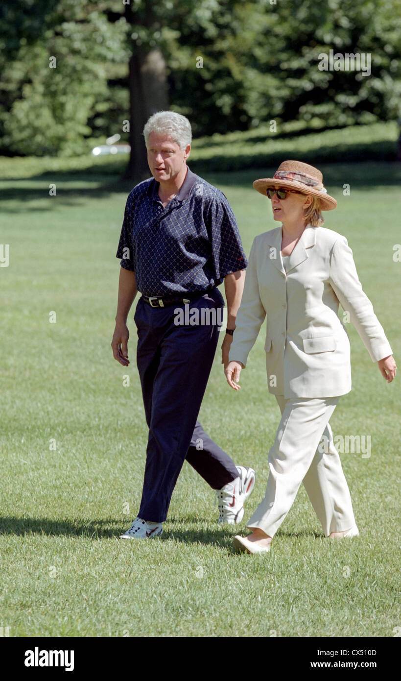 President Bill Clinton and first lady Hillary Clinton return from a ...