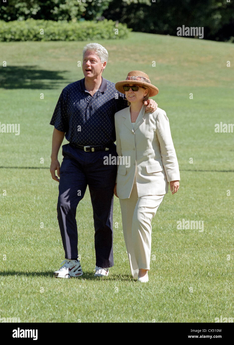 President Bill Clinton and first lady Hillary Clinton return from a ...