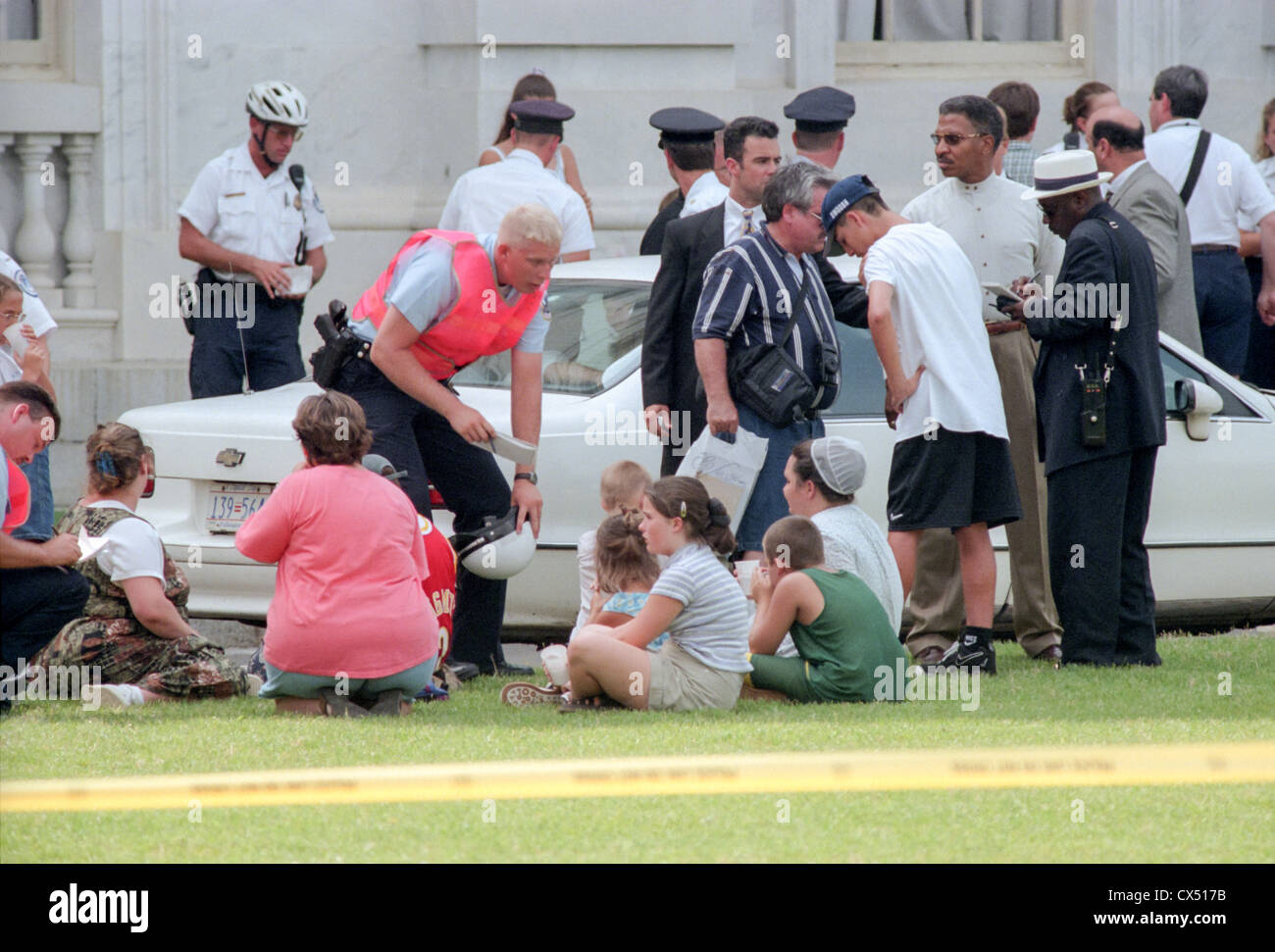 Police officers take statements from witnesses after a shooting erupted ...