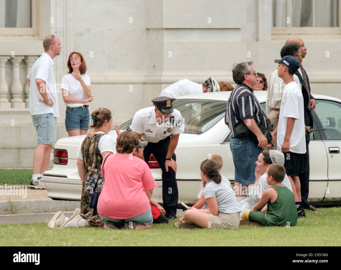 Police officers take statements from witnesses after a shooting erupted ...