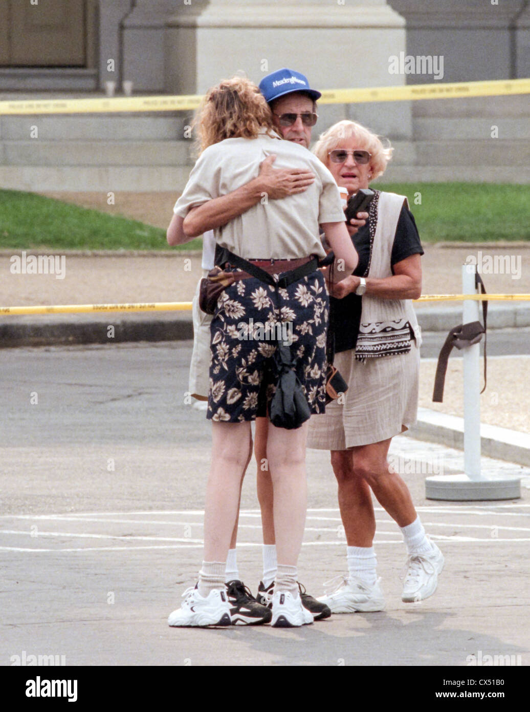 Tourists who witnessed a shooting at the US Capitol Building hug July ...