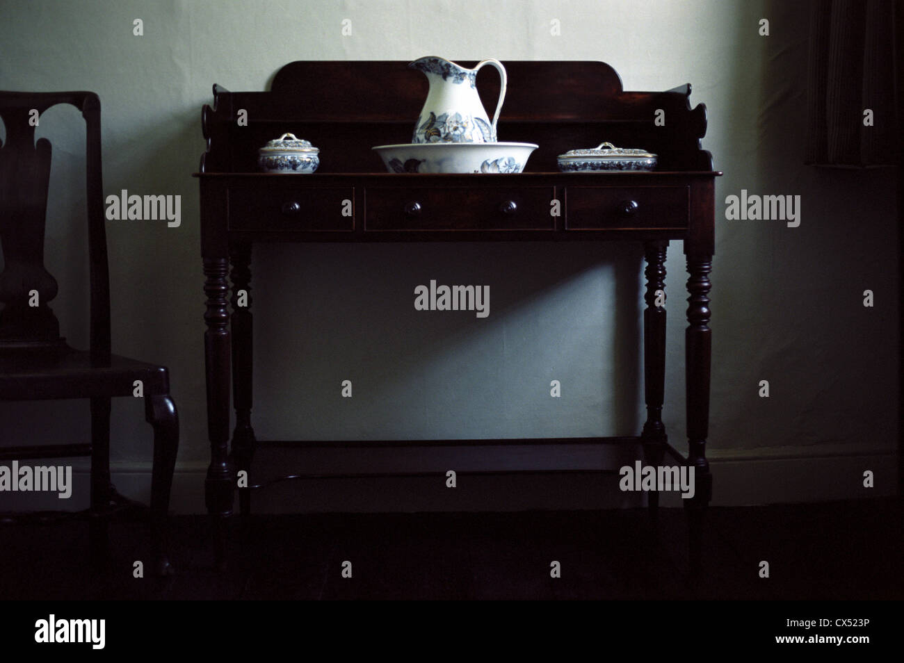 Sideboard with porcelain jug and bowls Stock Photo - Alamy