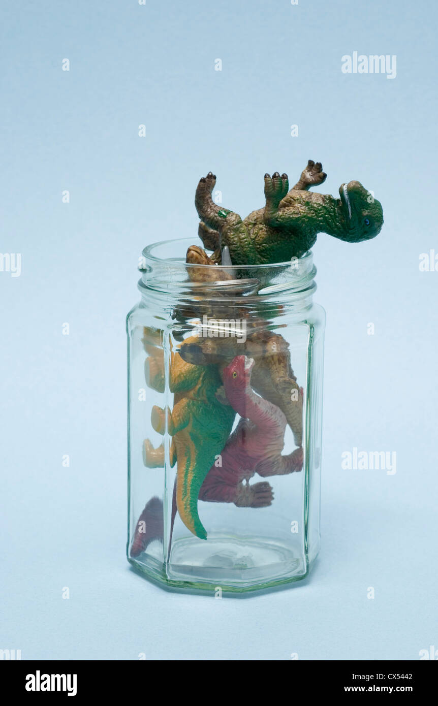 plastic toys in glass jar Stock Photo - Alamy