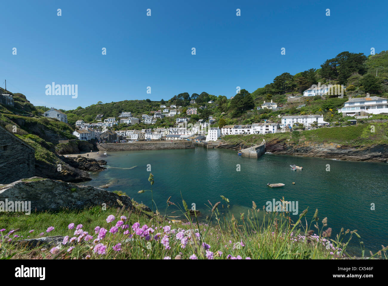 Polperro Harbour at high tide, a typical Cornish fishing village Stock ...