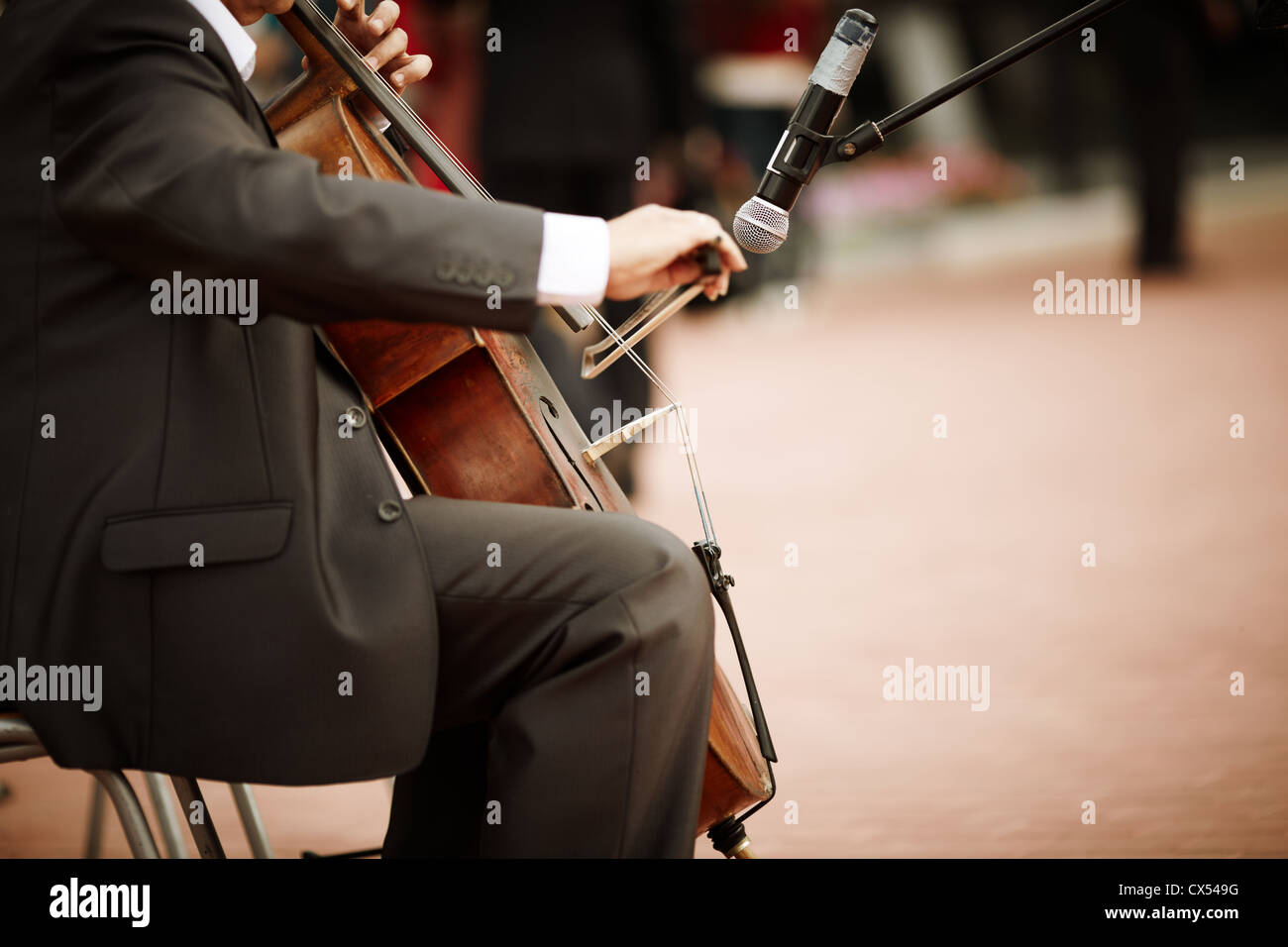 man playing cello on the concert, selective focus Stock Photo - Alamy