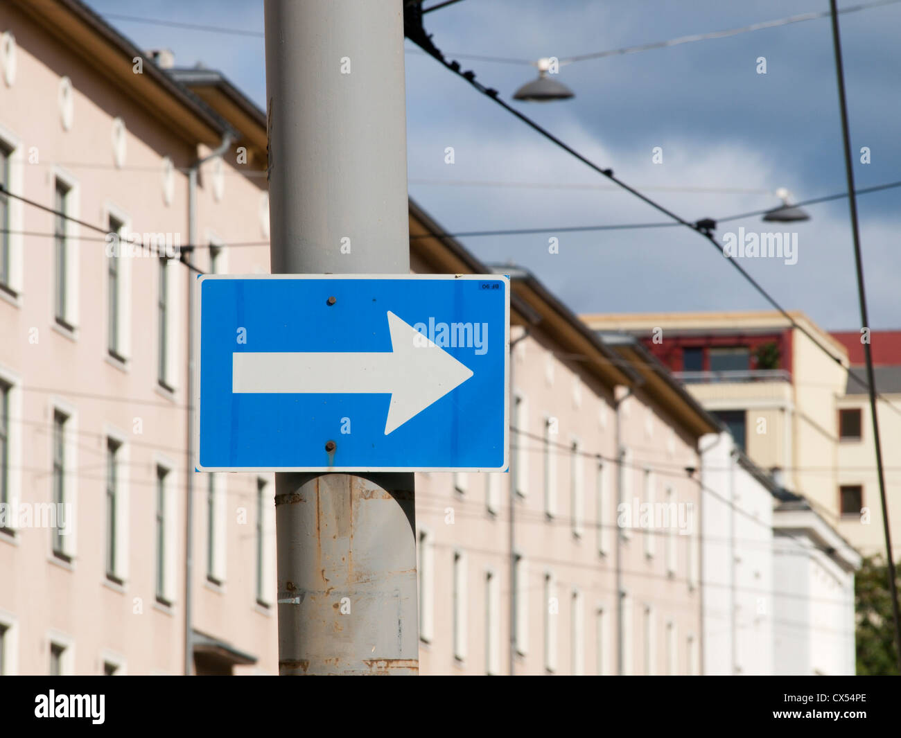 Blue and white Norwegian traffic sign, arrow pointing the right way ...