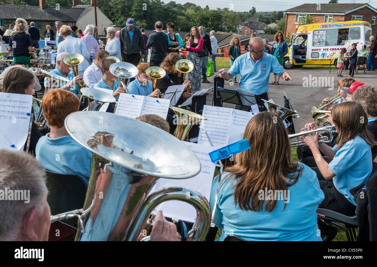 YOUNG MUSICIANS AND CONDUCTOR IN LYDNEY TRAINING BAND AT CHURCH FETE ...