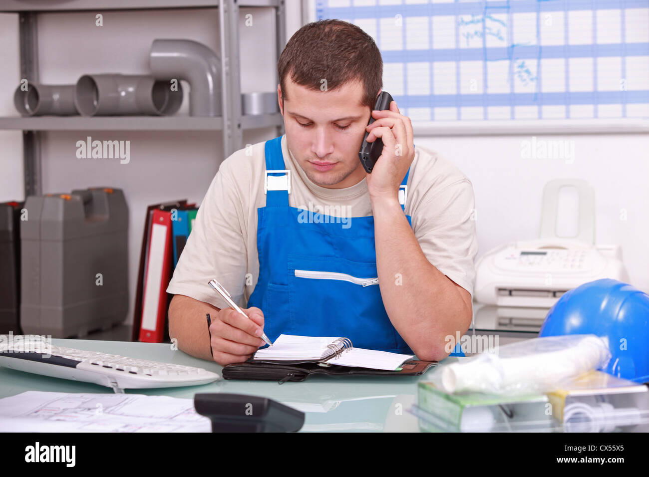 Man checking stock and ordering new parts Stock Photo - Alamy