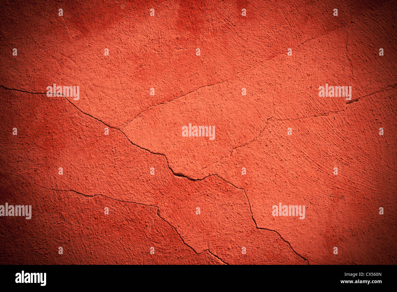 Dark red flat cracked background material texture Stock Photo - Alamy